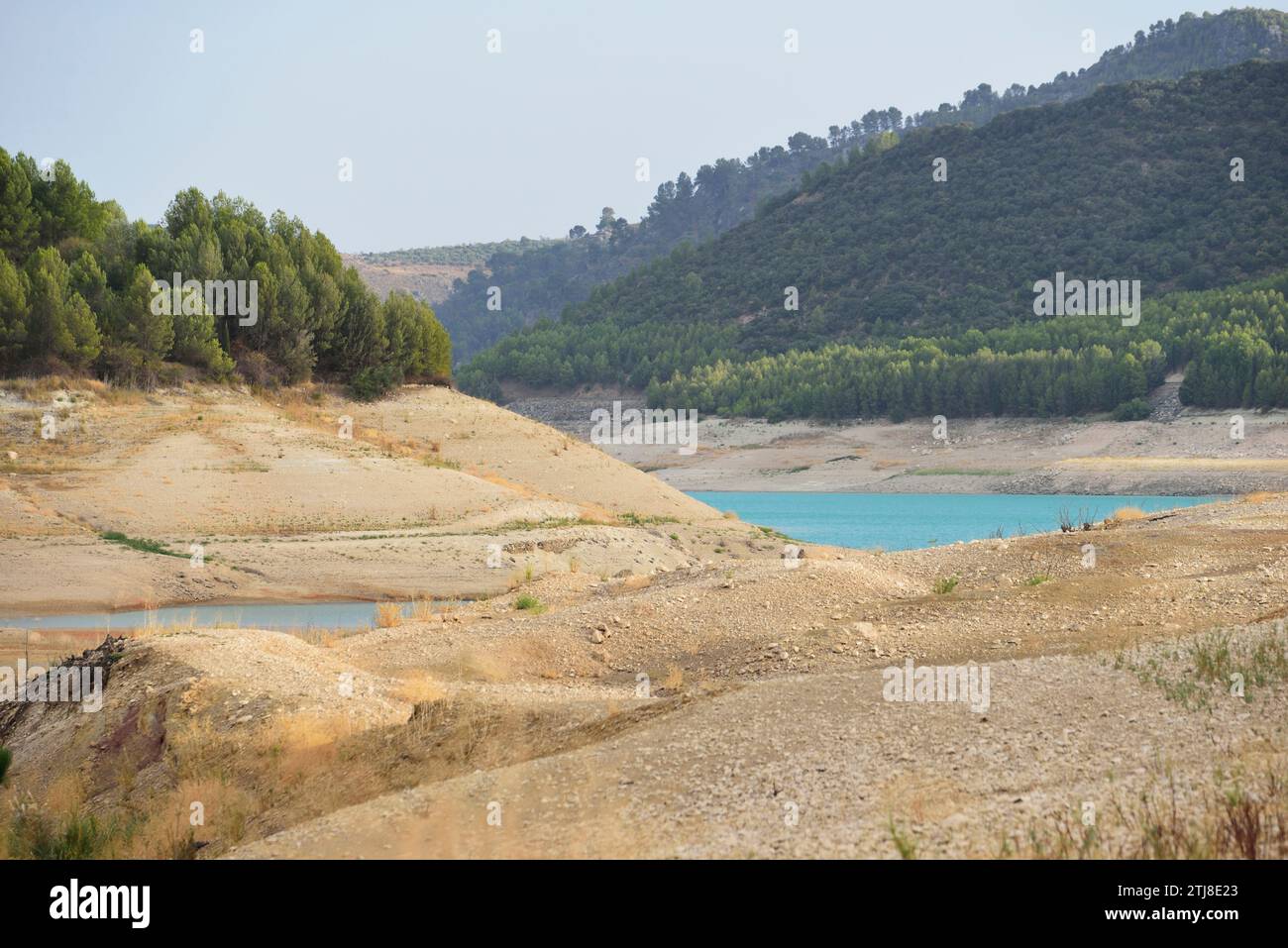 Colomera reservoir with very low water level due to drought. Benalúa de ...