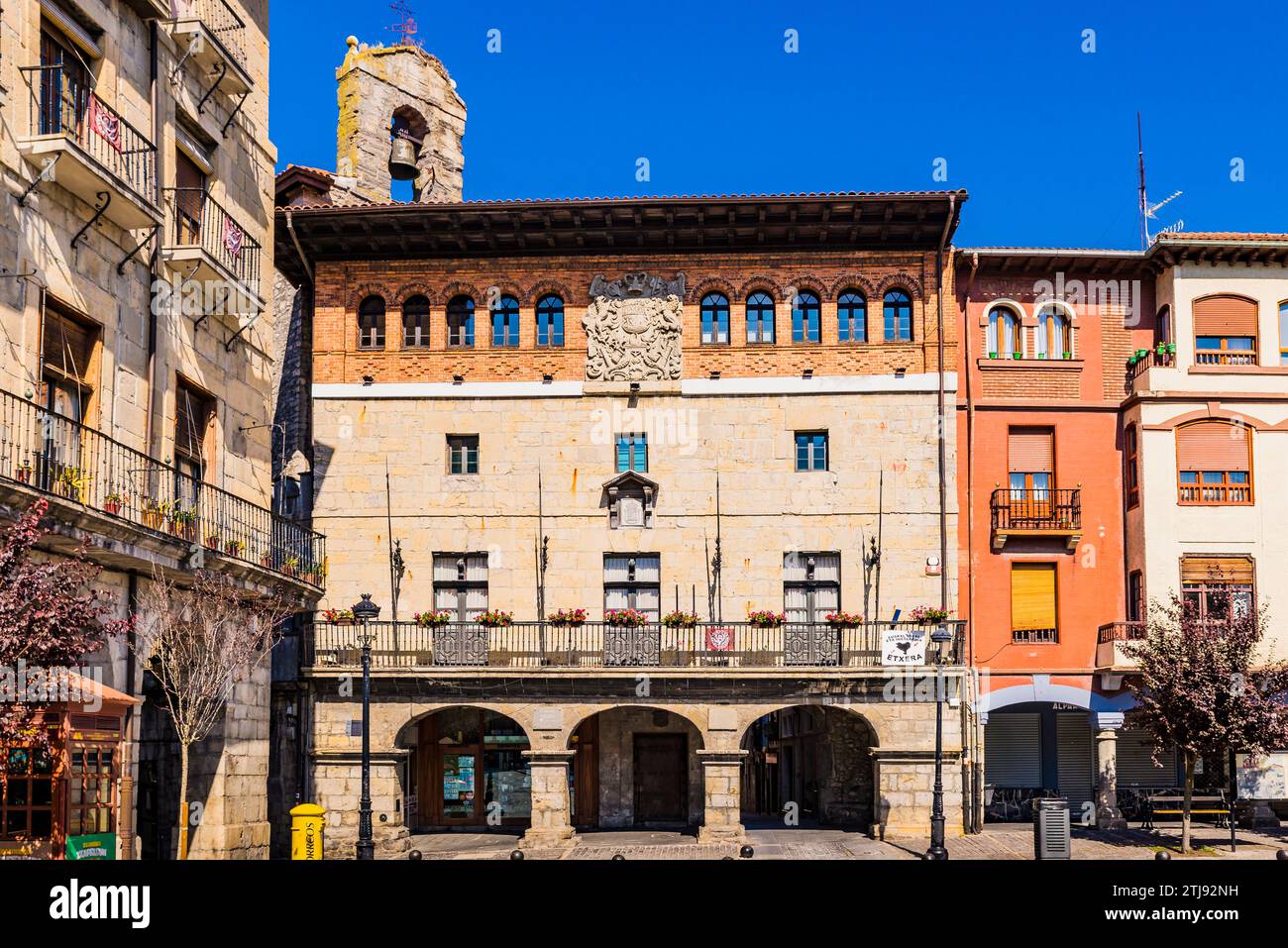 Town hall building with large coat of arms on the facade. Plaza de los ...