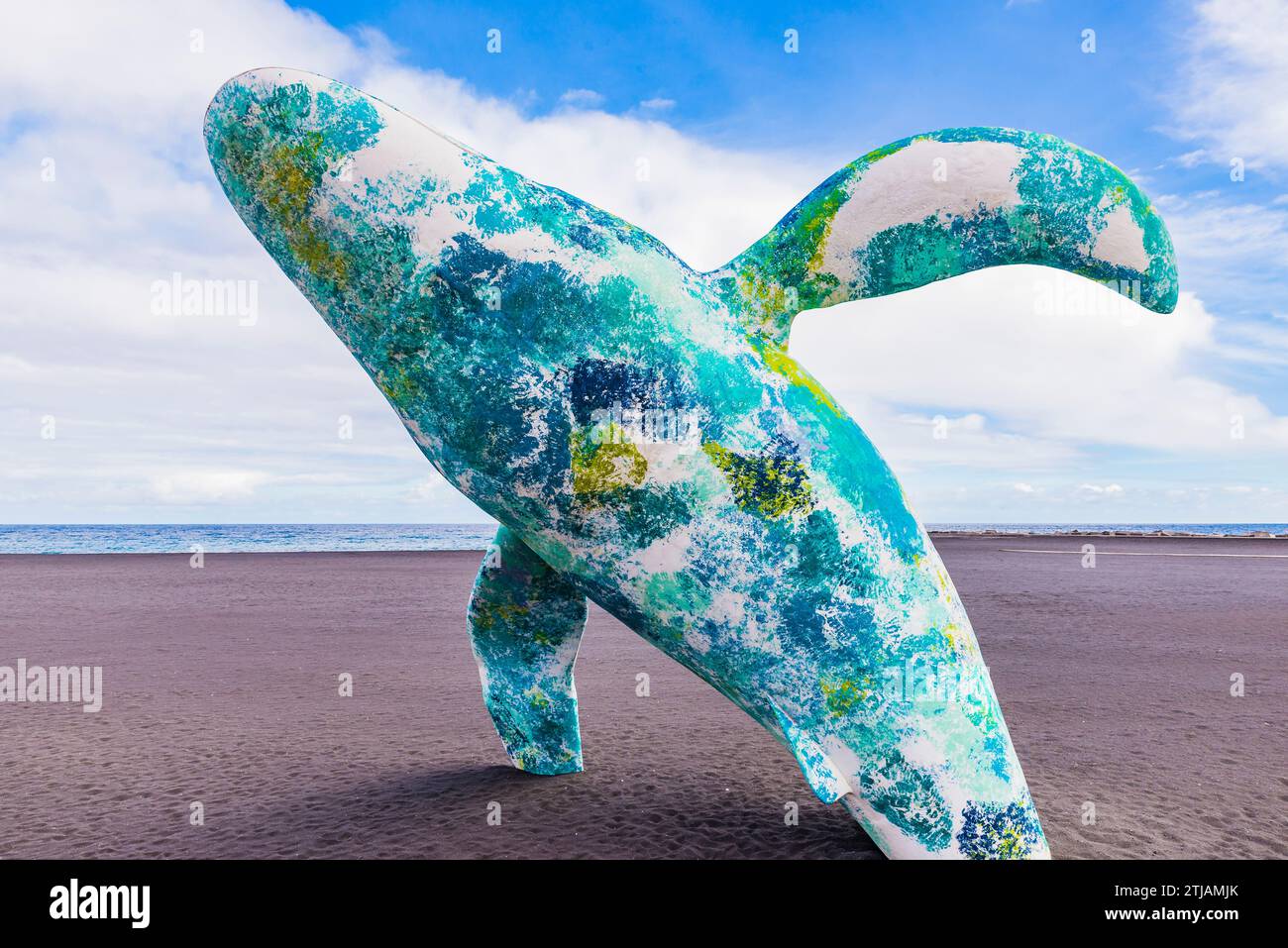 Whale sculpture on the black sand of the beach in front of the Avenida ...
