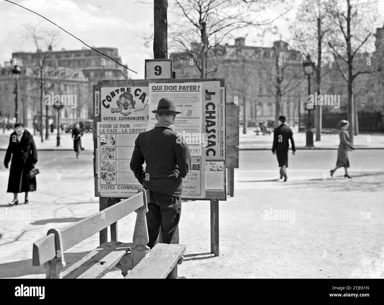 Man in Paris looks at billboard with French Parti Communiste election ...