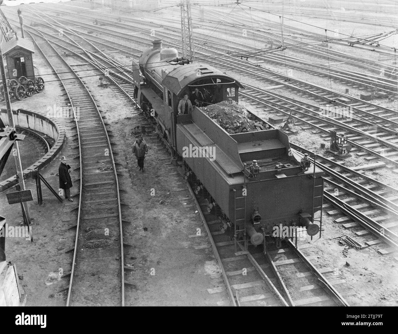 Steam locomotive with tender filled with coal on the railway yard ca ...