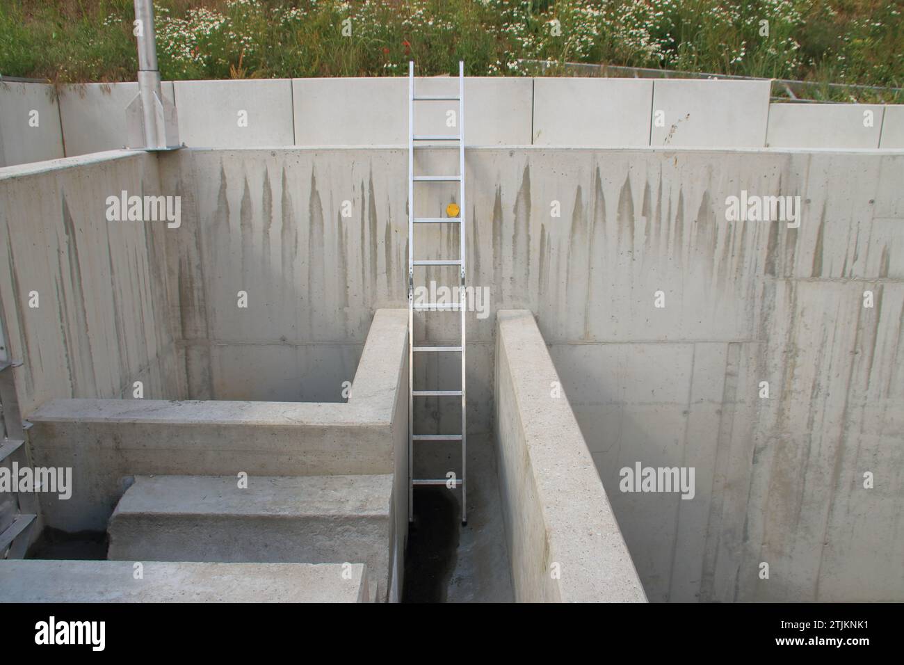 Ladder stands without protection in a sewer in a sewage treatment plant ...