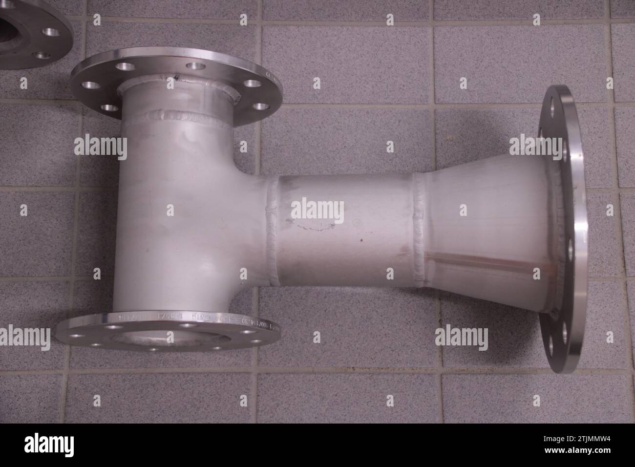 T-piece of a stainless steel pipeline Stock Photo - Alamy