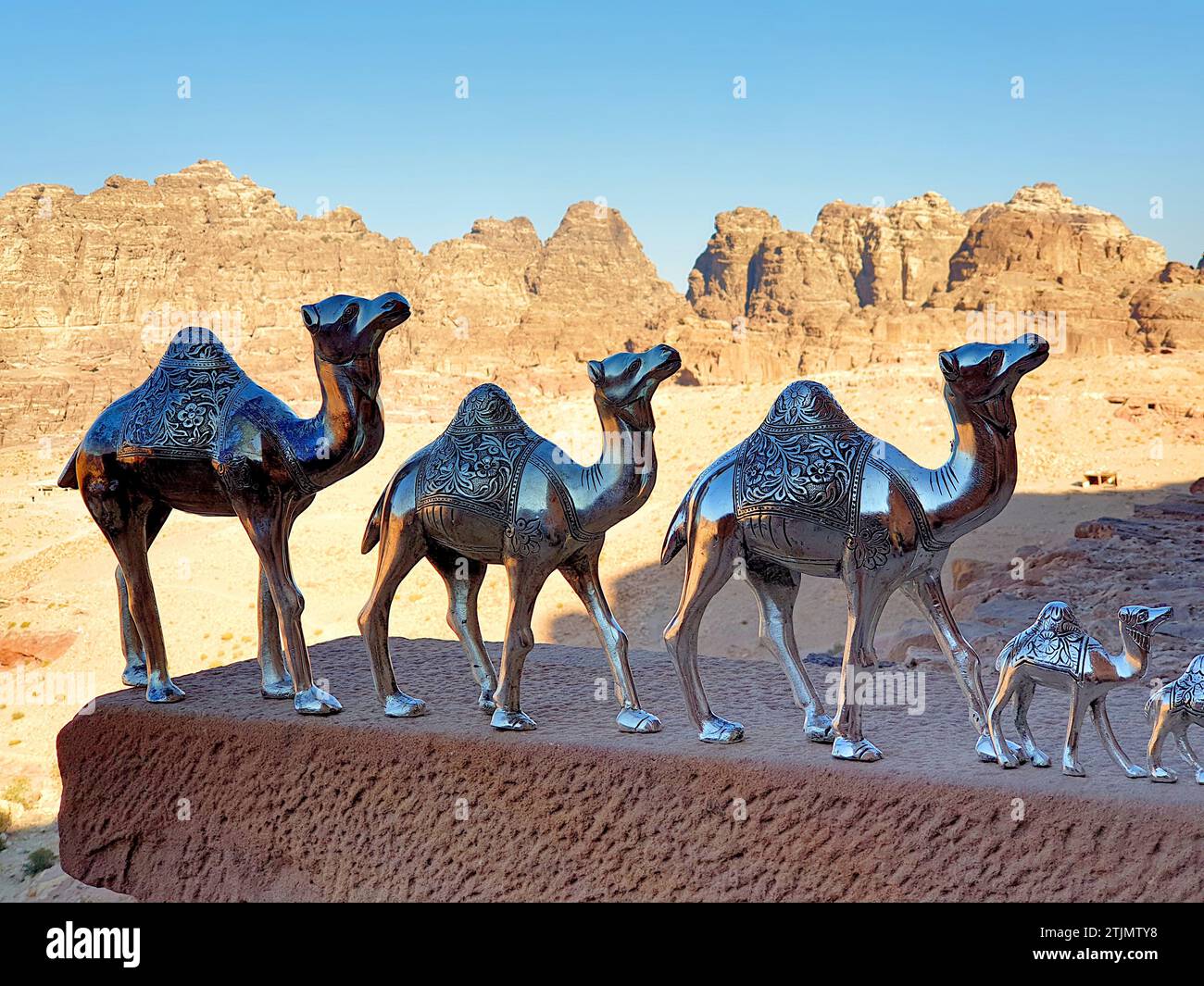 Metal camel souvenirs offered for sale en rote to Petra, Jordan Credit ...