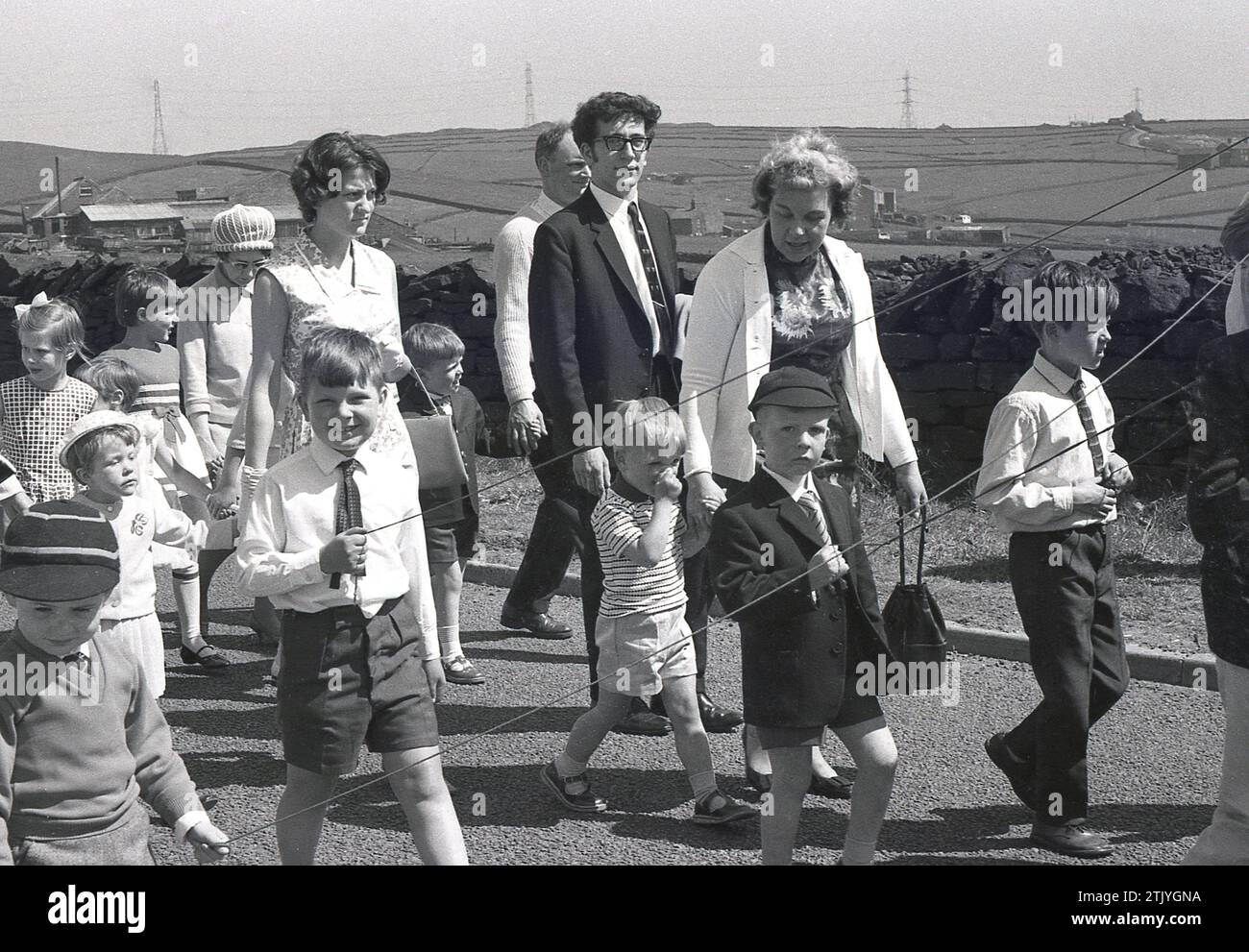 1960s, historical, families taking part in a procession for the ...