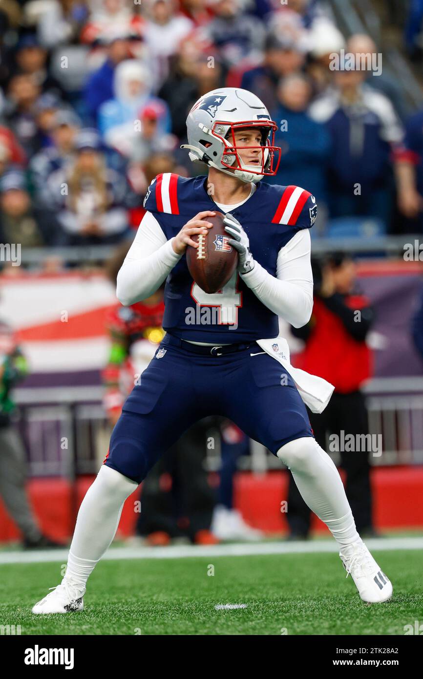New England Patriots quarterback Bailey Zappe (4) drops back to make a ...