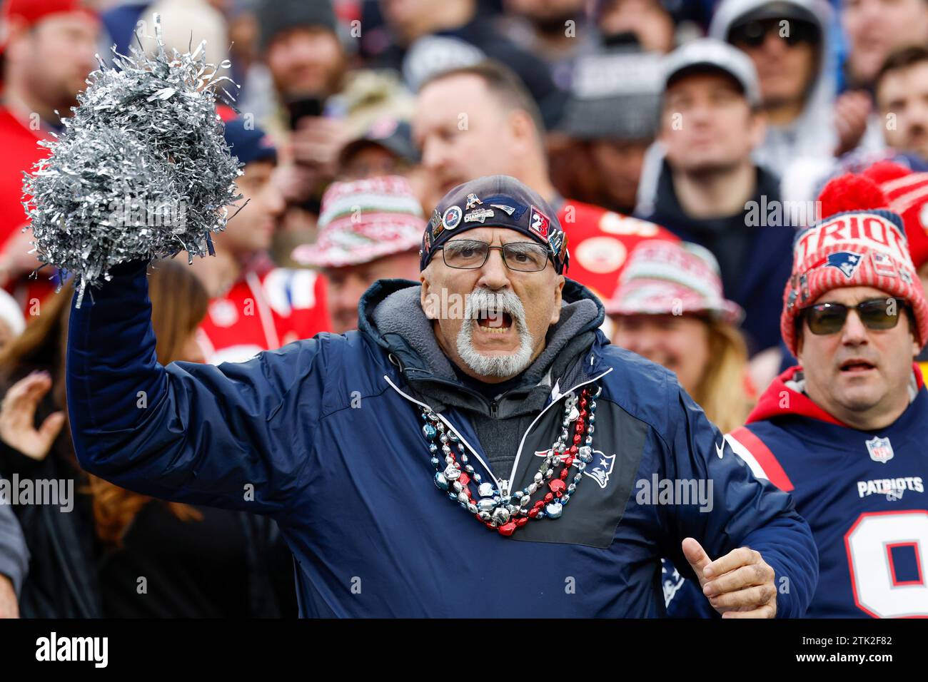 A New England Patriots fan cheers during the first half of an NFL ...