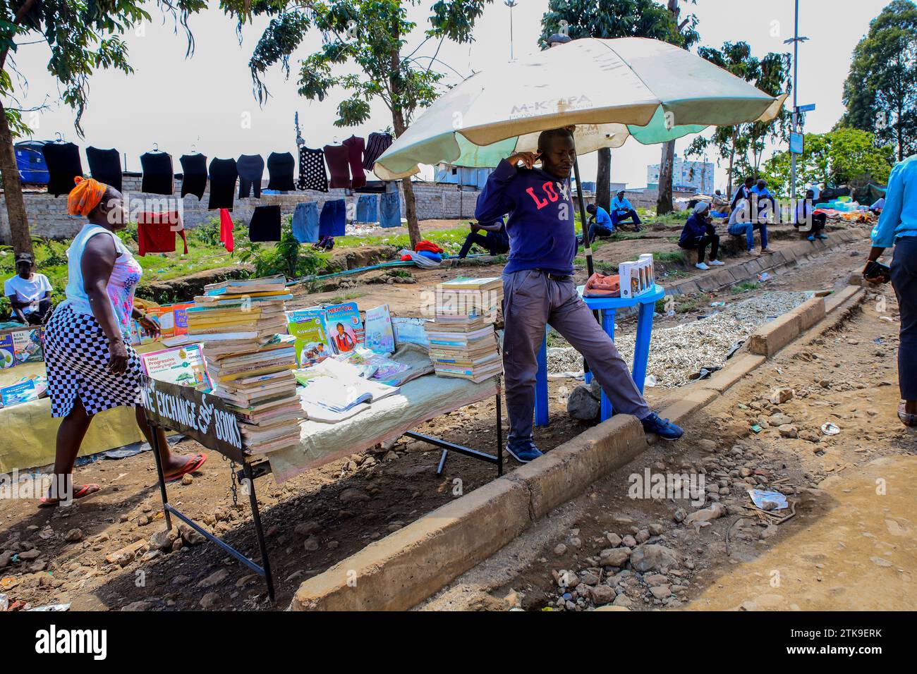 Hawkers selling their products by the streets in Kibera Slum. A view ...