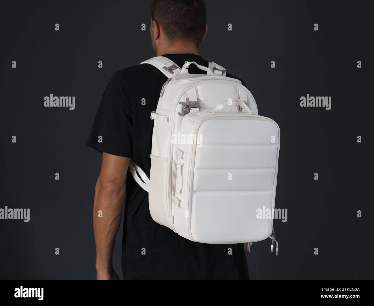 Man with stylish white double backpack for travel Stock Photo - Alamy