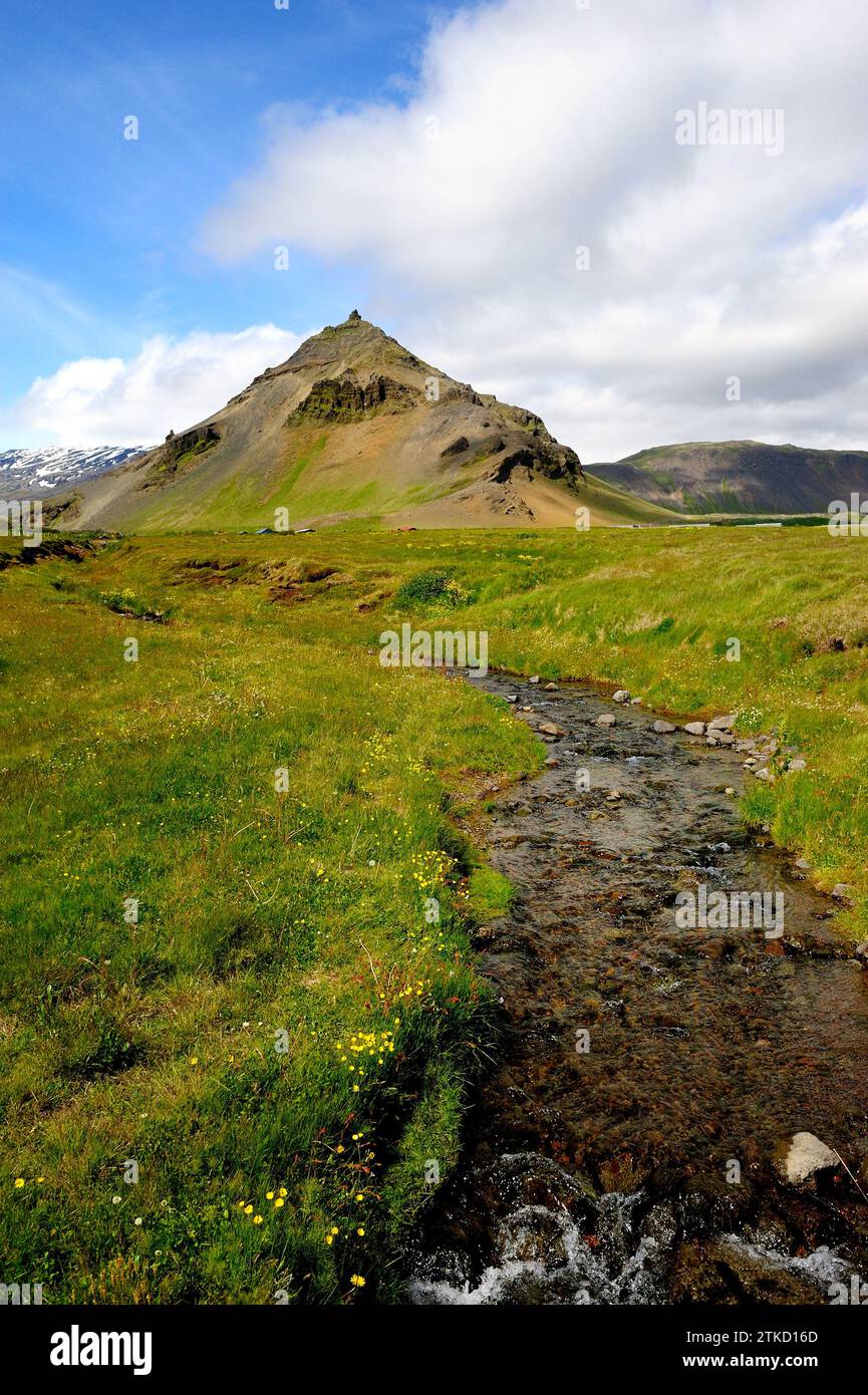 Farmland and farm building below the volcanic mountain Stock Photo - Alamy
