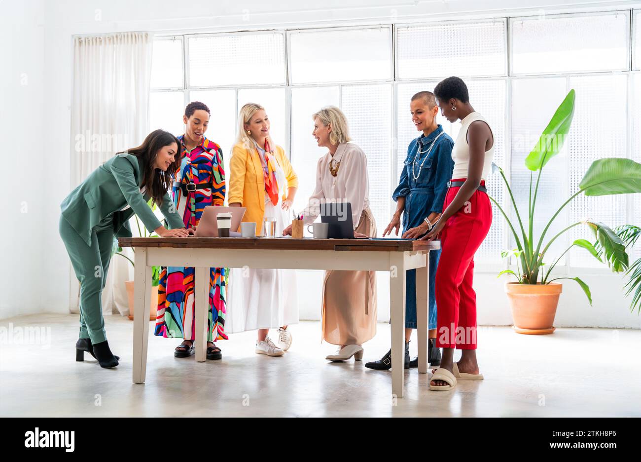 Group of beautiful confident businesswomen meeting in the office ...