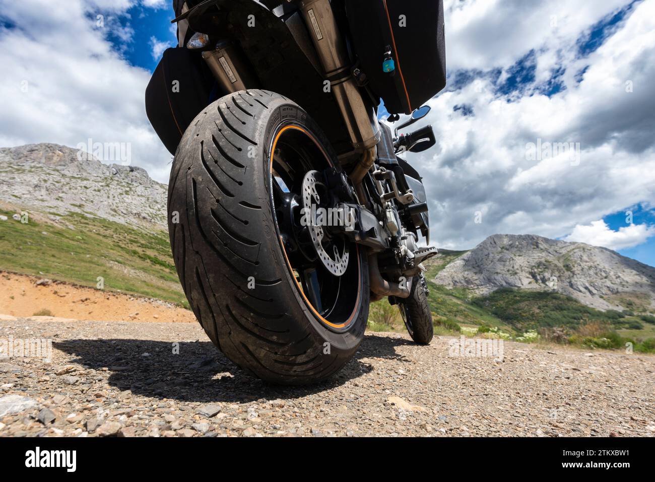 A touring motorike is parked up overlooking the Picos Mountains in ...