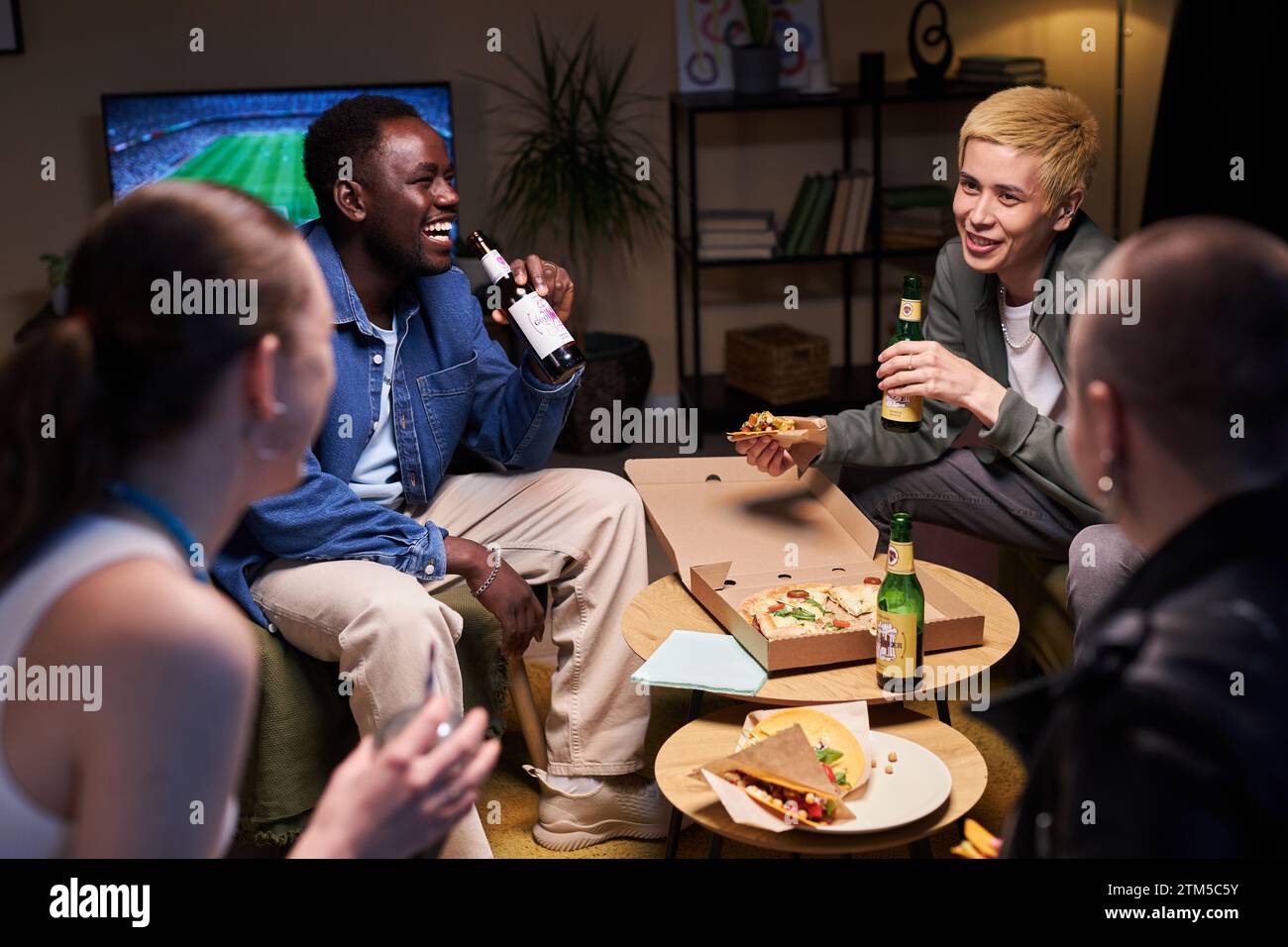 Young Students Laughing at Party Stock Photo - Alamy