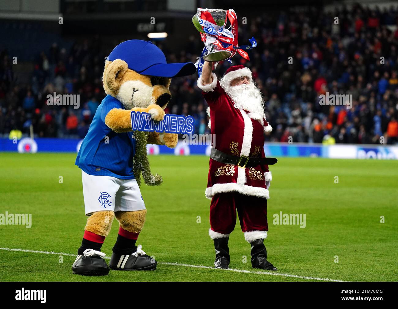 Broxi Bear and Santa holds up the Viaplay Cup Trophy during the cinch ...