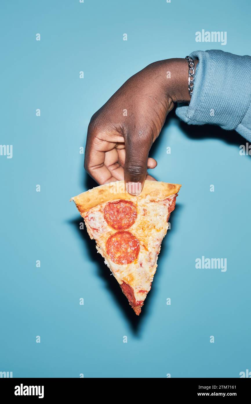 Hand pizza slice close up hi-res stock photography and images - Alamy