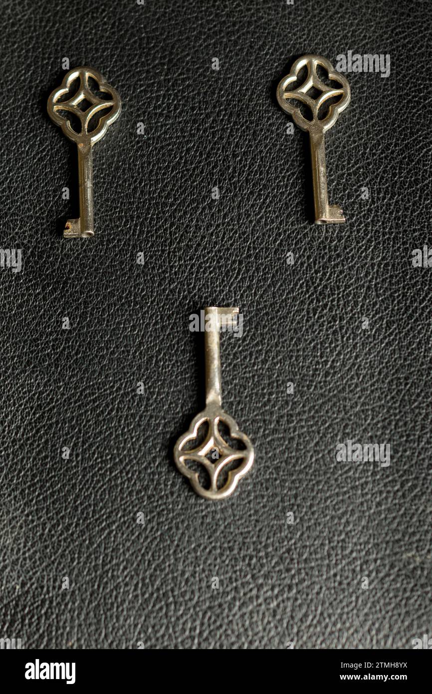 silver antique keys on dark rough black background vertically Stock ...