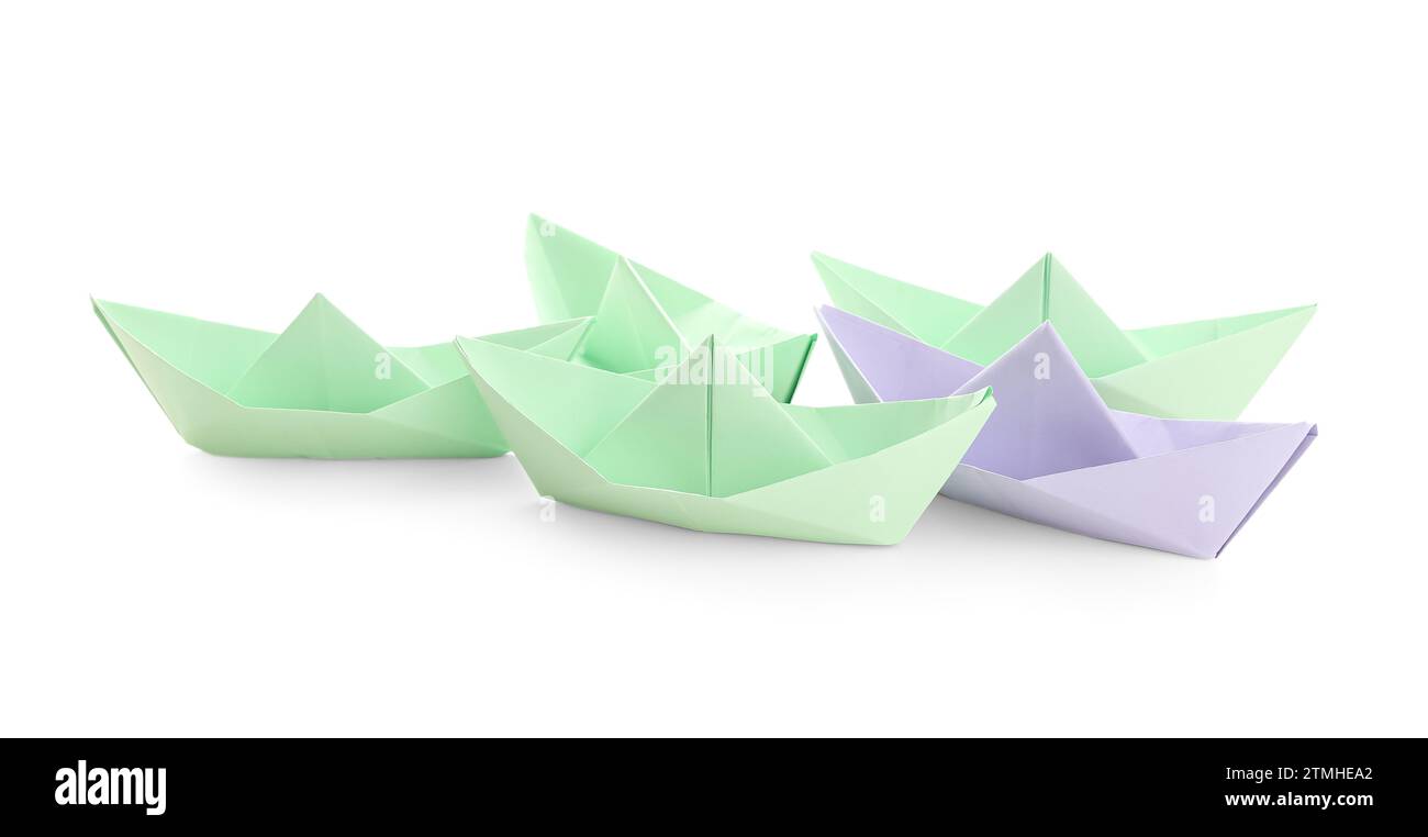 Colorful origami boats on white background Stock Photo - Alamy