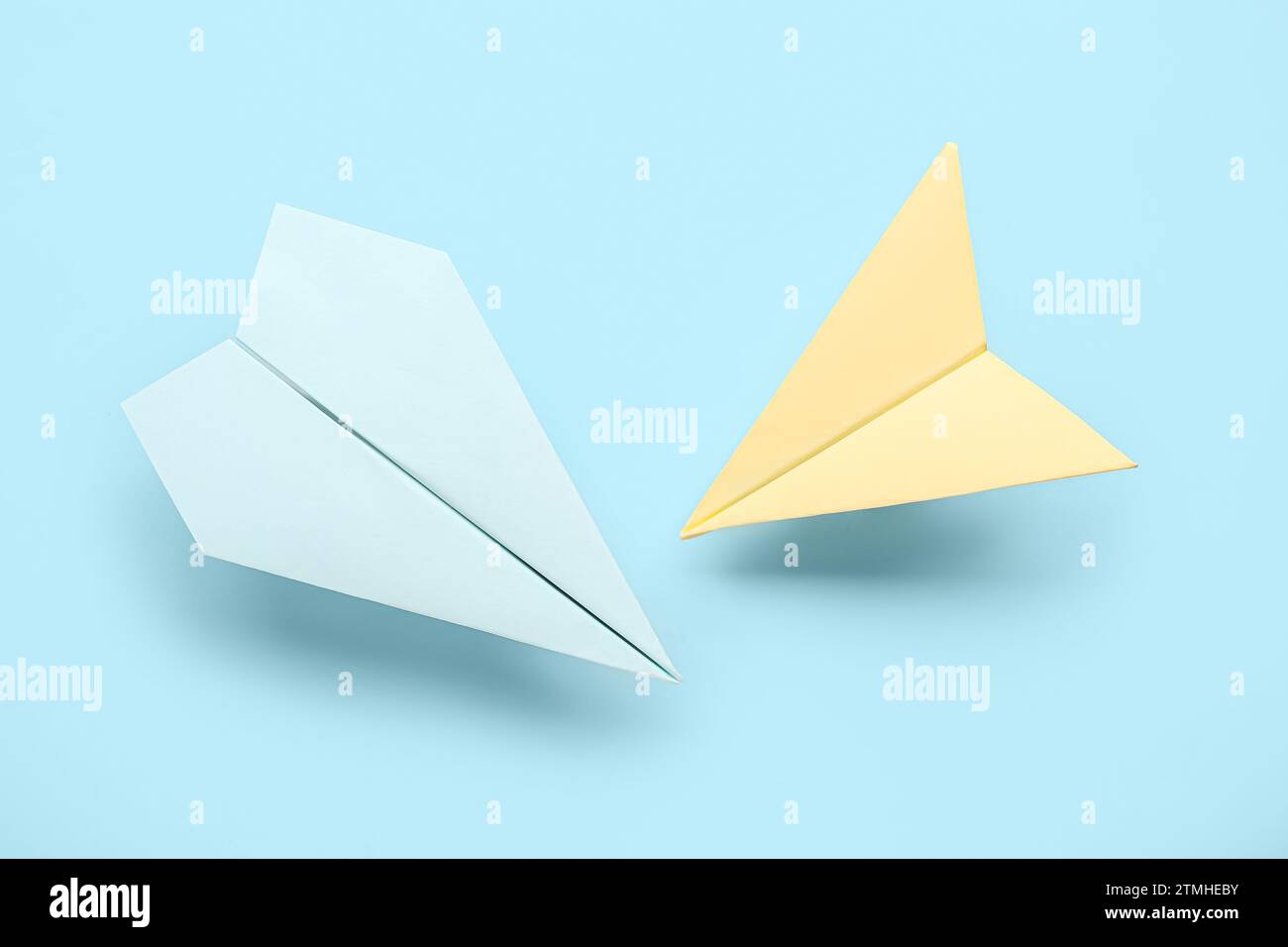 Colorful paper planes on blue background Stock Photo - Alamy
