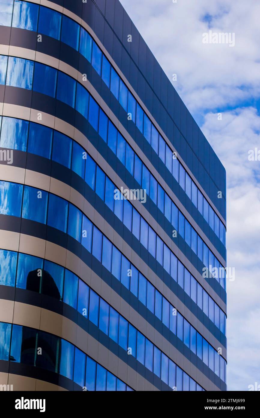 Simple generic building of a modern architecture with glass windows ...