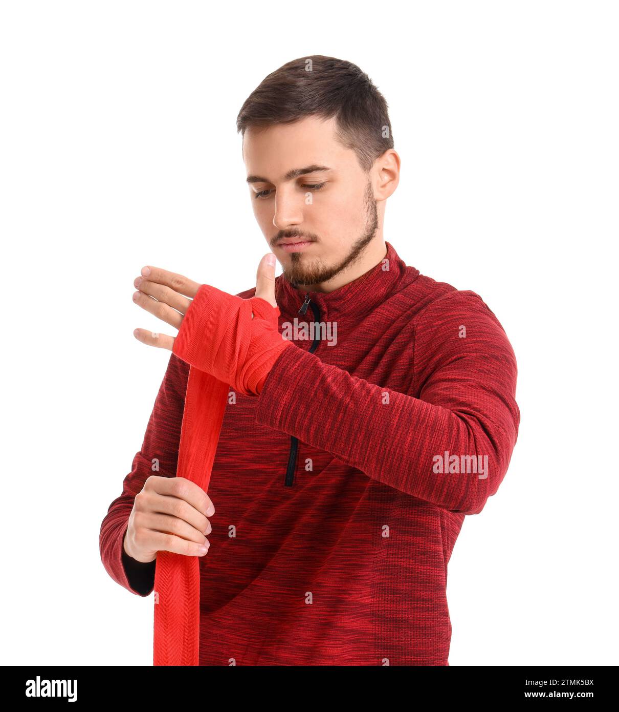 Young man wrapping hands with boxing wraps on white background. Concept ...