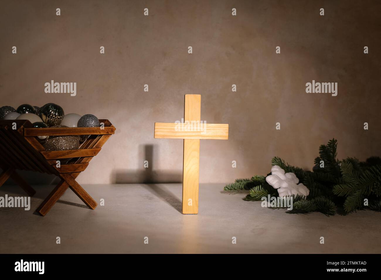 Cross with manger and decorations on grunge background. Concept of ...