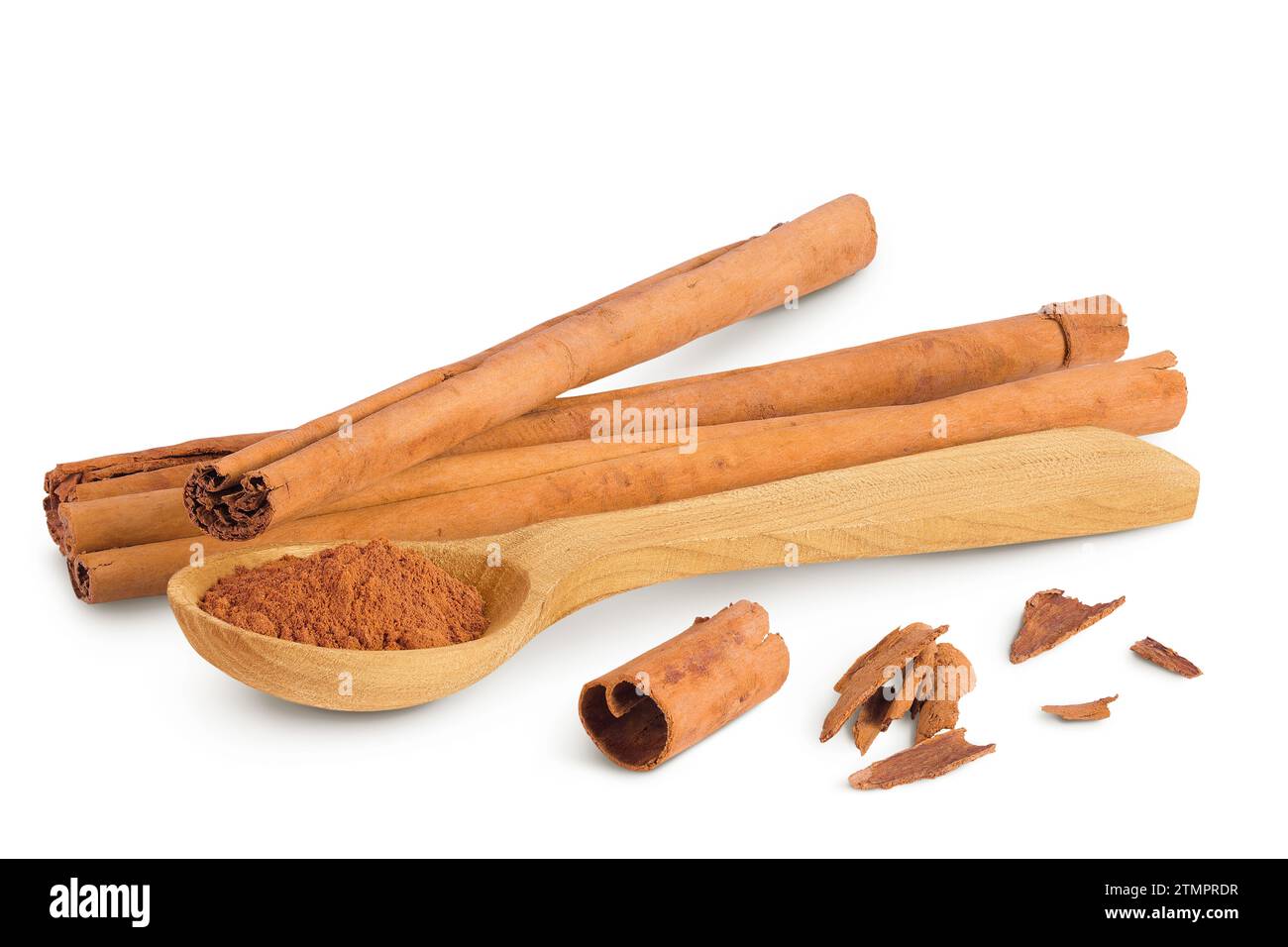 Cinnamon sticks with powder in wooden spoon isolated on white ...