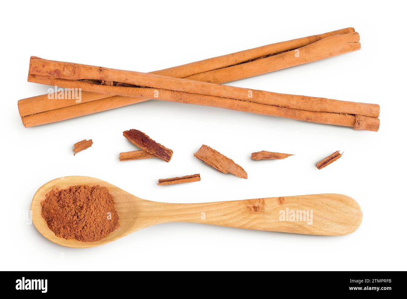 Cinnamon sticks with powder in wooden spoon isolated on white ...