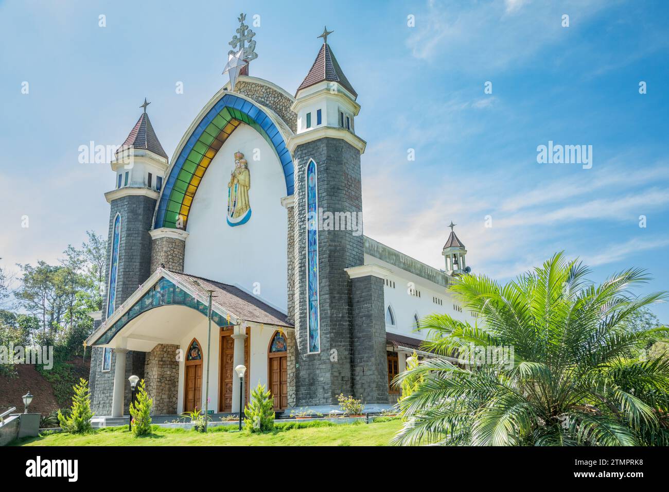 Velankanni Matha catholic church facade with palms in foreground ...