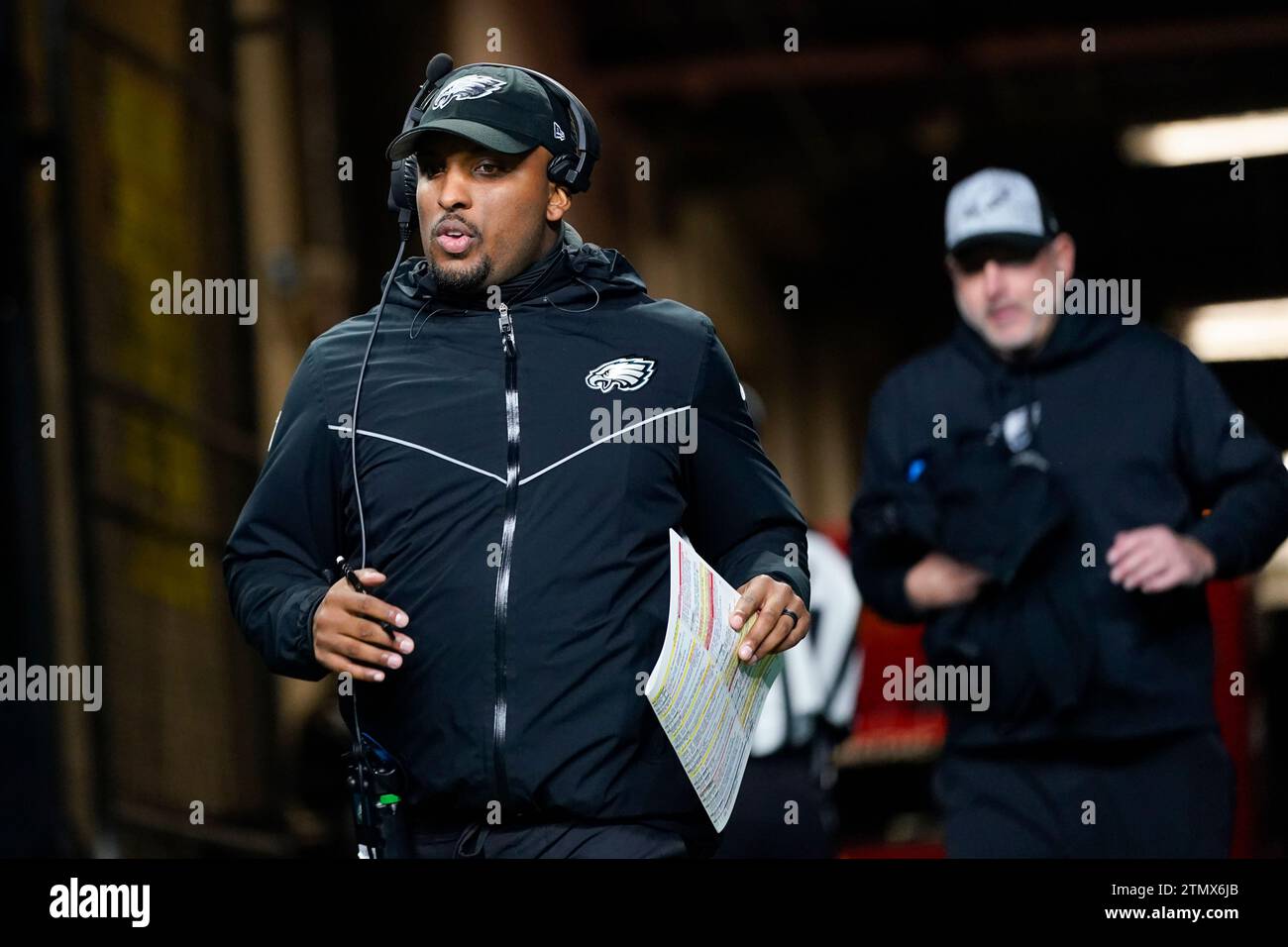 Philadelphia Eagles offensive coordinator Brian Johnson jogs onto the ...