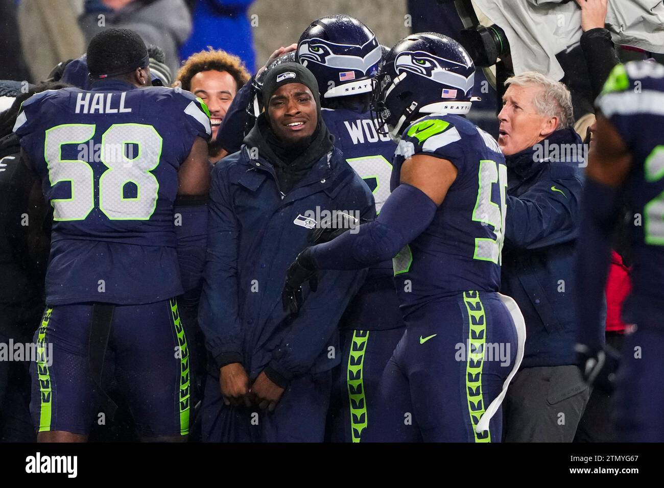 Seattle Seahawks linebacker Derick Hall (58), Devon Witherspoon, center ...
