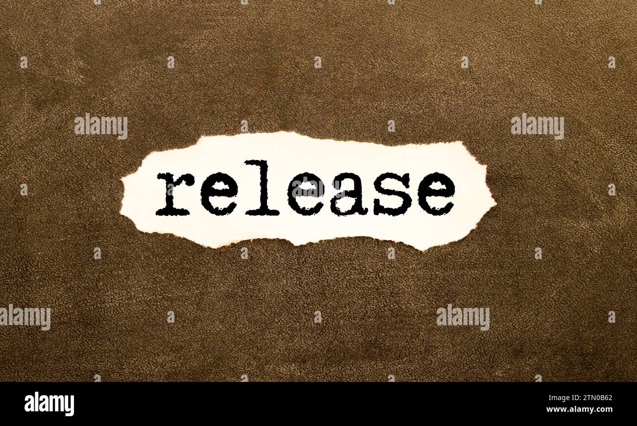 Press Release a lot of stickers are scattered on a wooden background ...