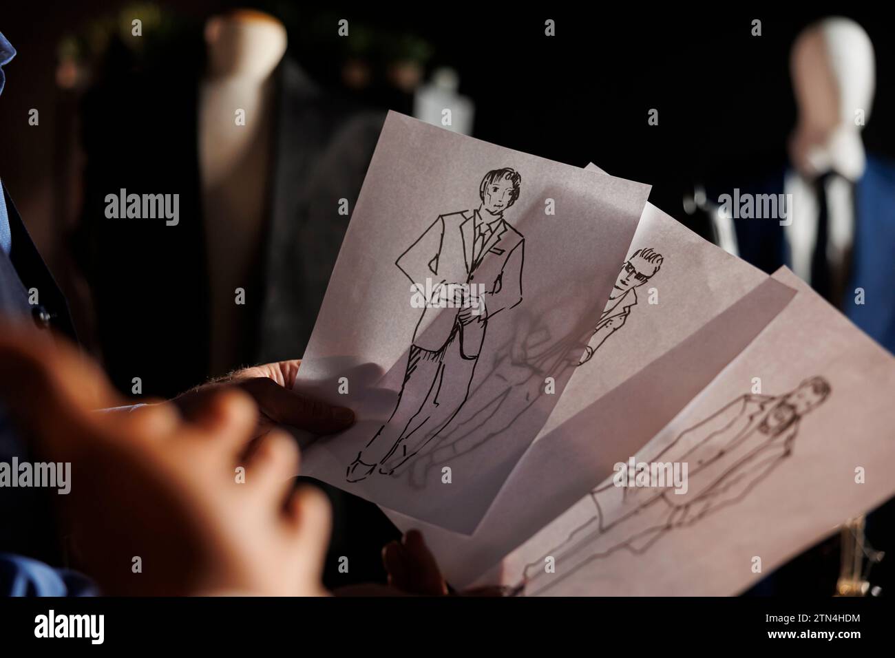 Extreme close up of sketch drawings in tailoring studio showing cool ...