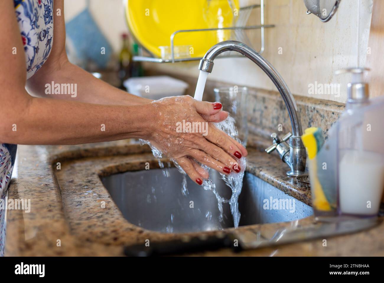 Cook washing her hands to cook. Healthy eating Stock Photo - Alamy