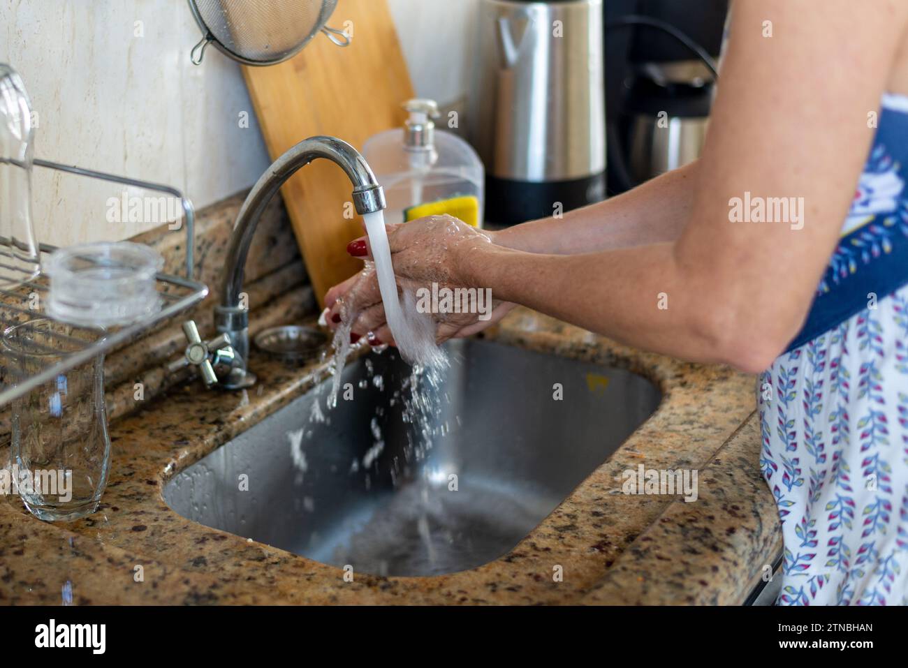 Cook washing her hands to cook. Healthy eating Stock Photo - Alamy