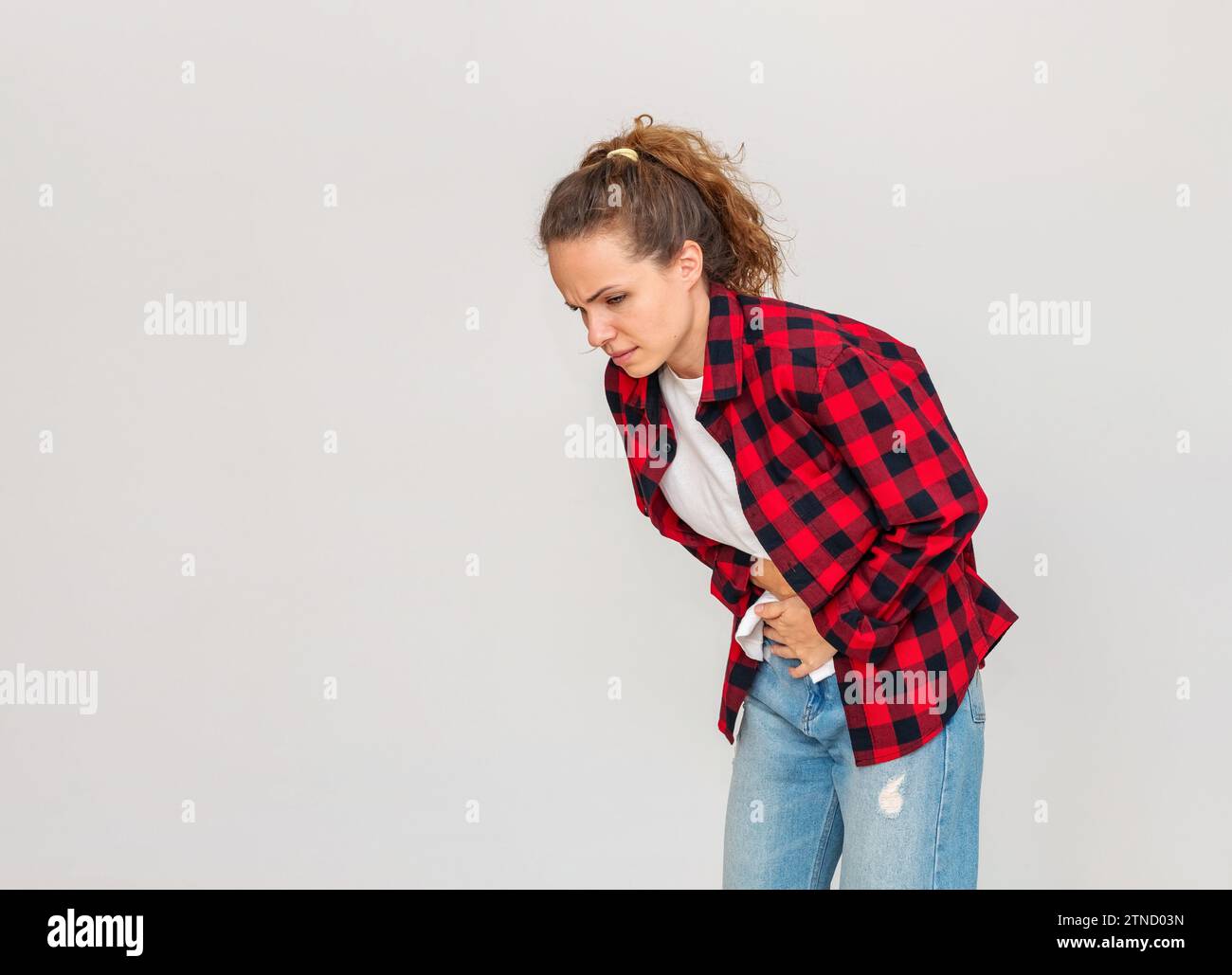 Primary dysmenorrhea during menstruation period. Woman holding her ...