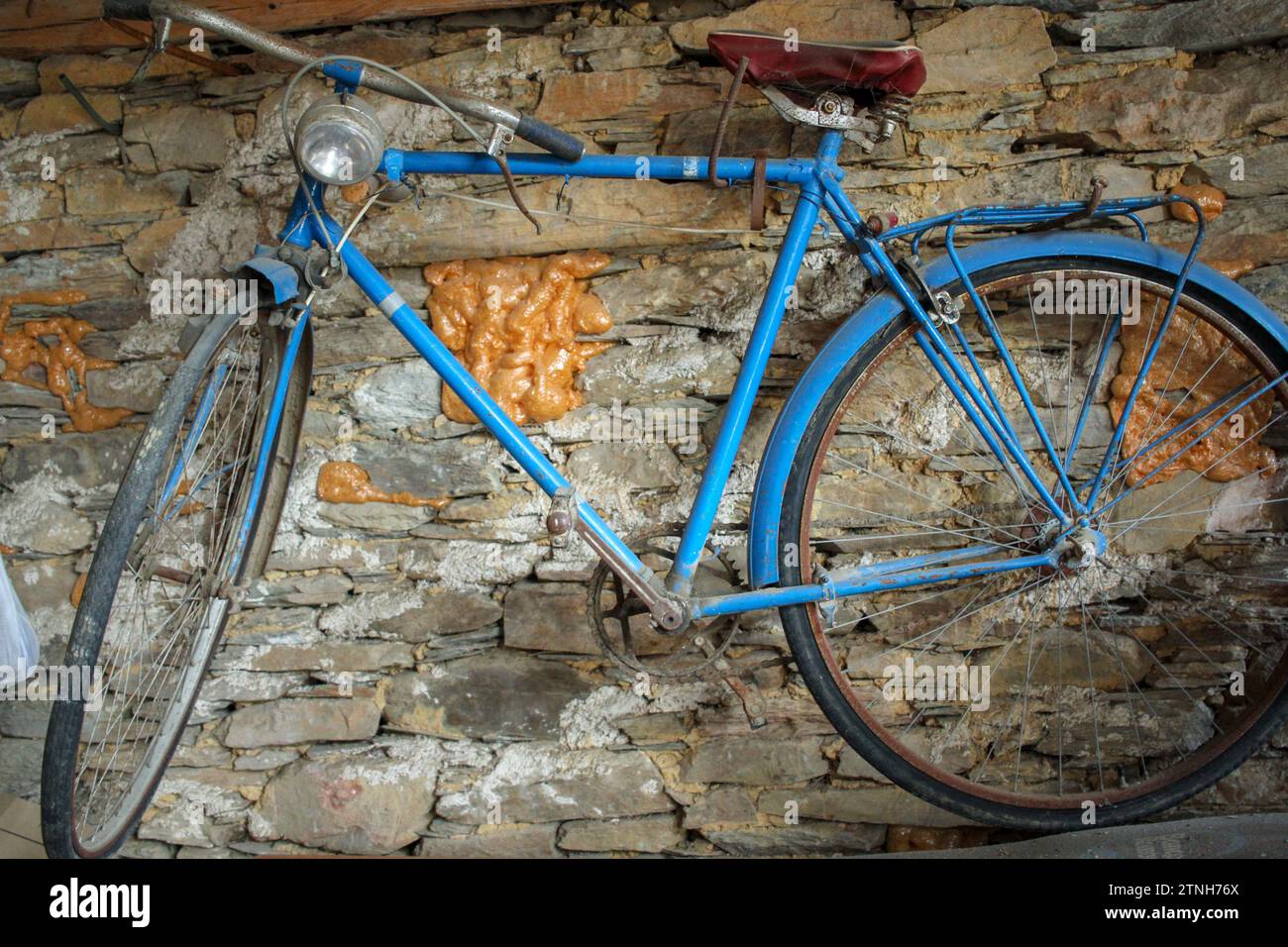 Vintage Elegance: Old Bicycle Adorning Stone Wall Stock Photo - Alamy