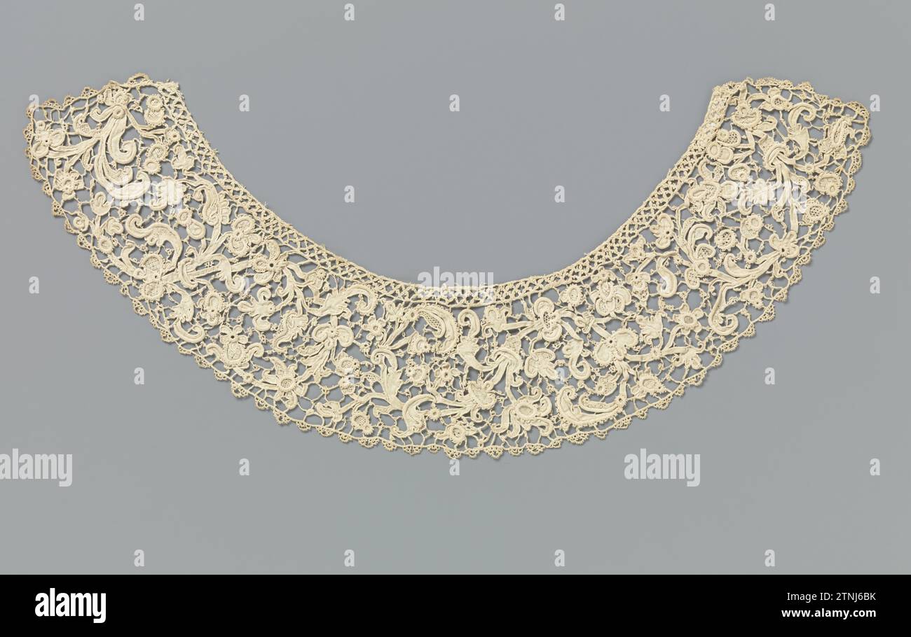 Collar of needle side with a variety of flowers and curling leaves on ...