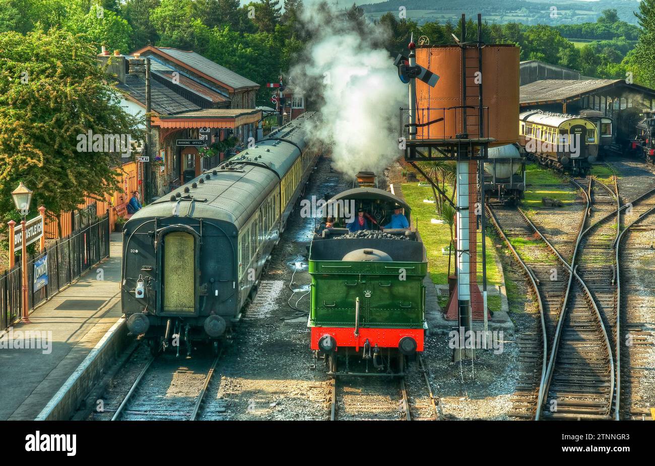 Buckfastleigh Railway Station, Devon, with an engine blowing steam and ...
