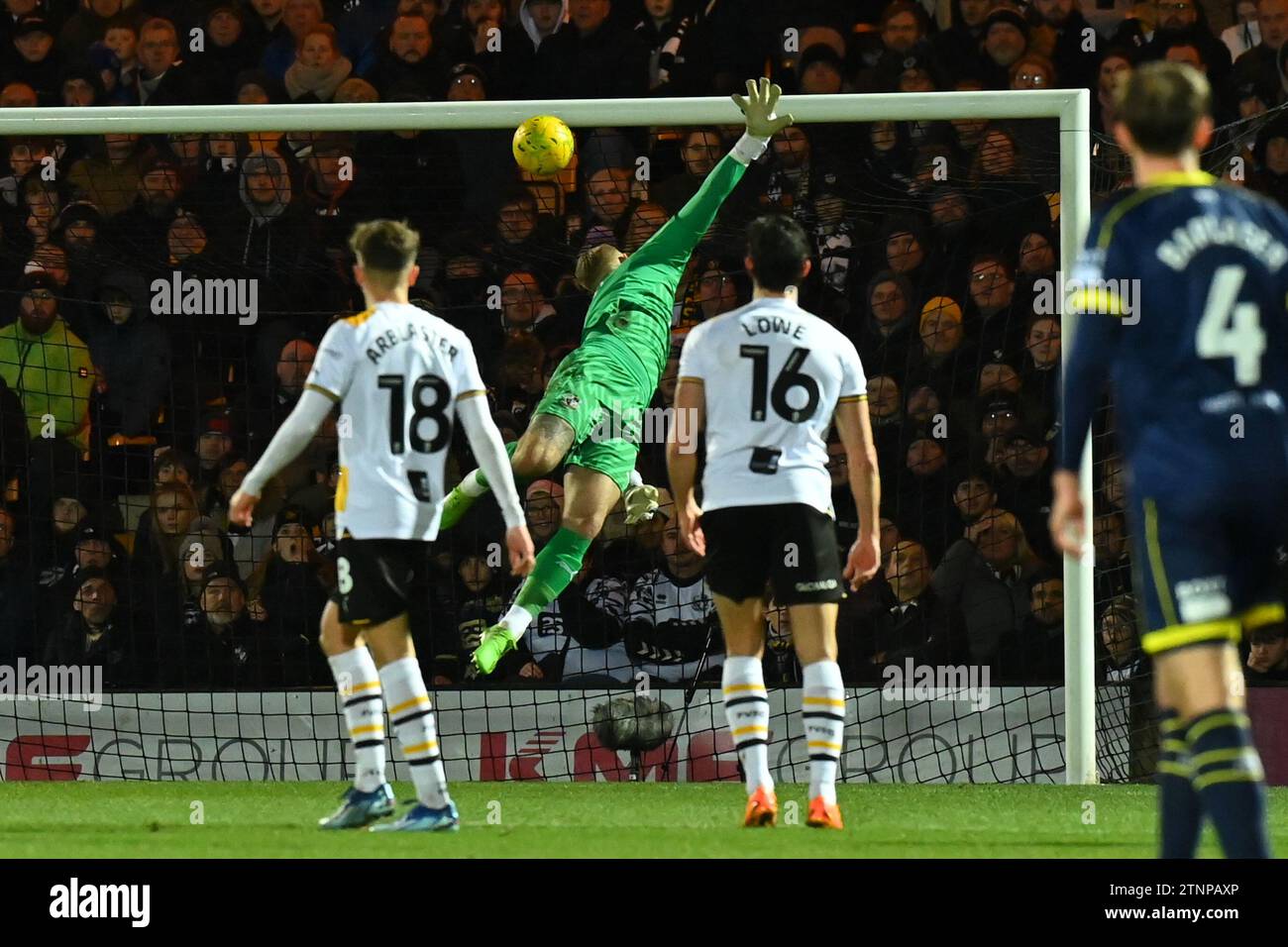 Burslem, UK, 19th December 2023. Jonny Howson's deflected shot loops ...