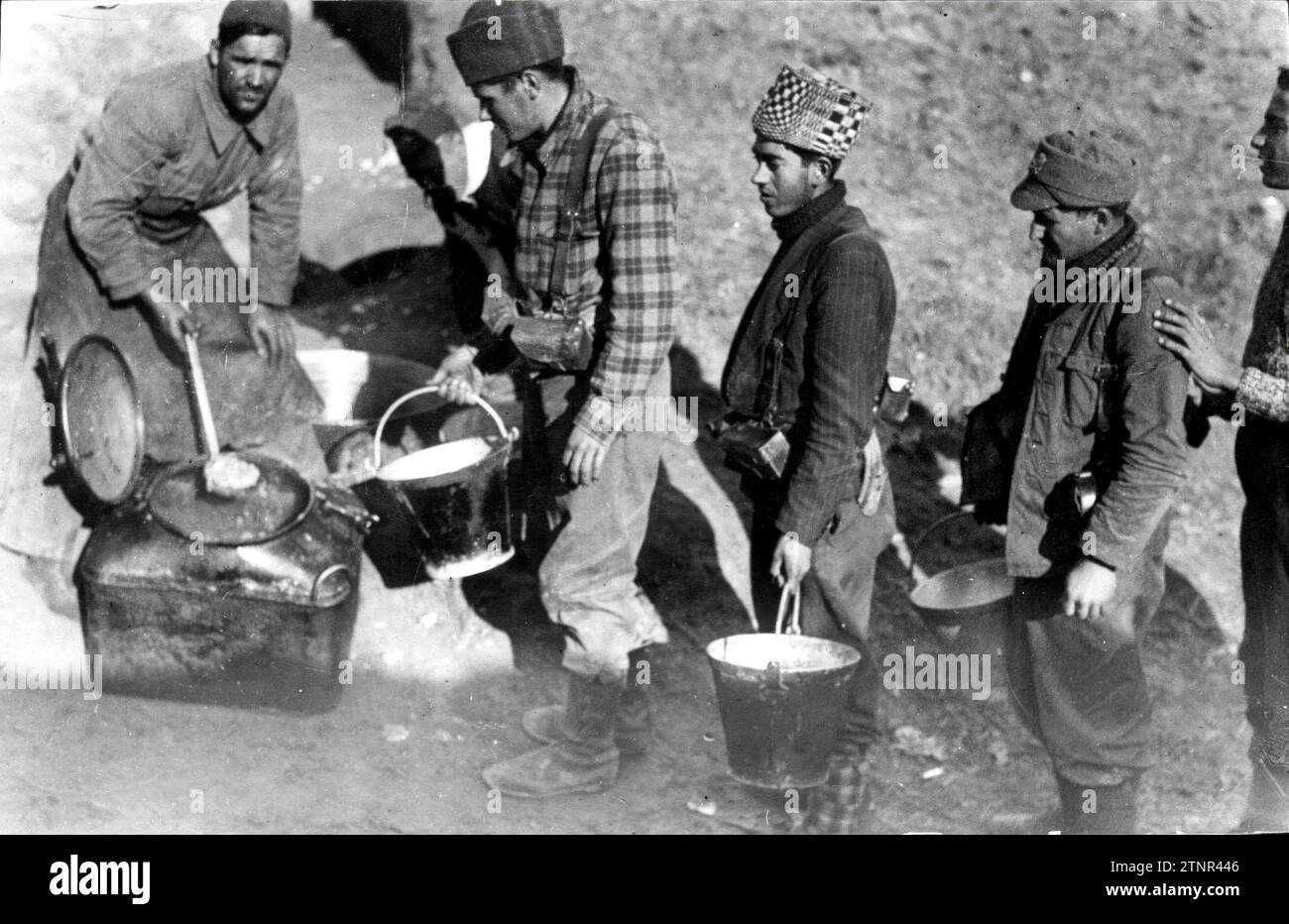 12/19/1936. Soldiers Collecting Food in Buckets for Their Companions in ...