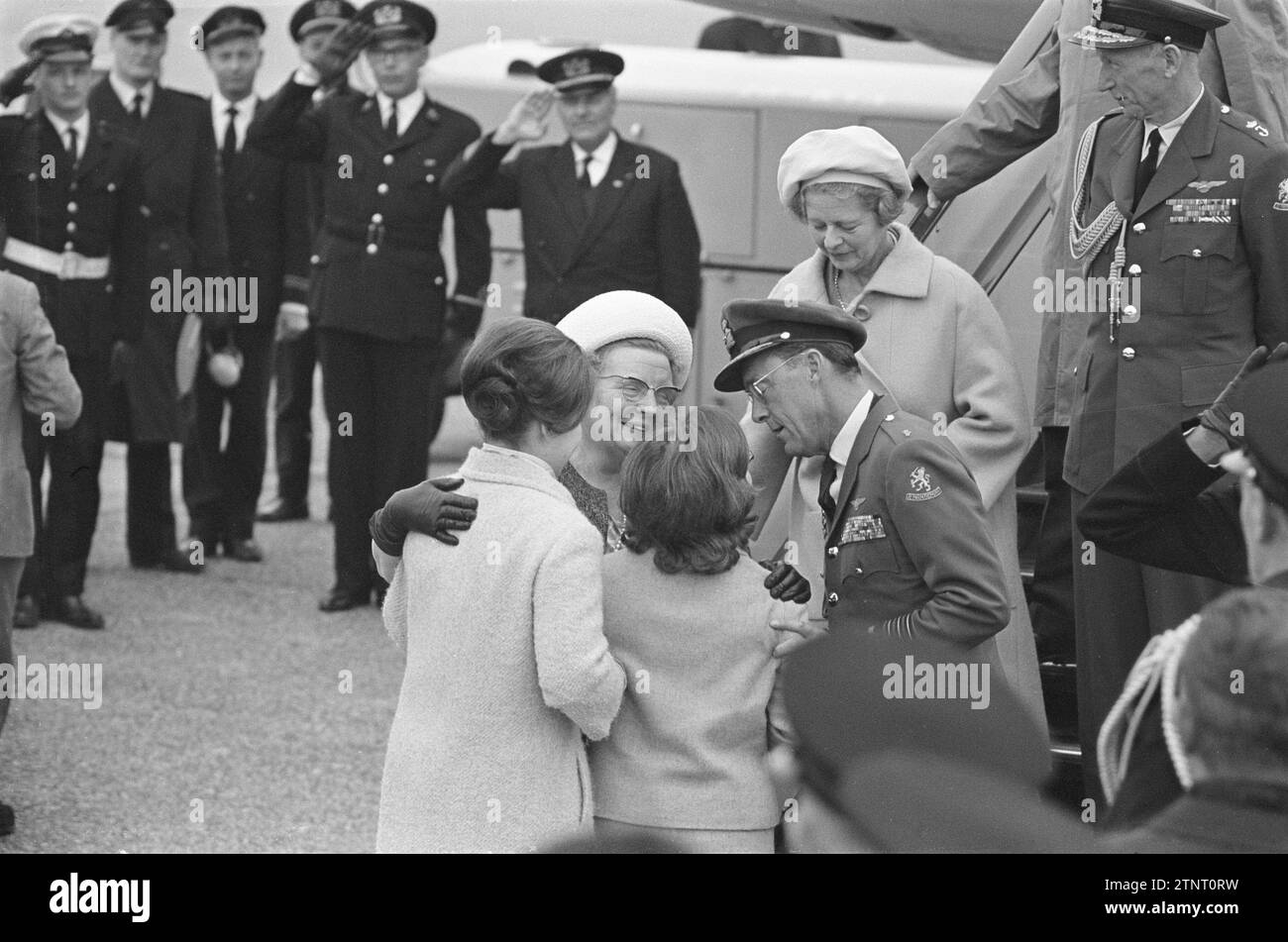 Queen Juliana and Prince Bernhard are greeted by two of their daughters ...