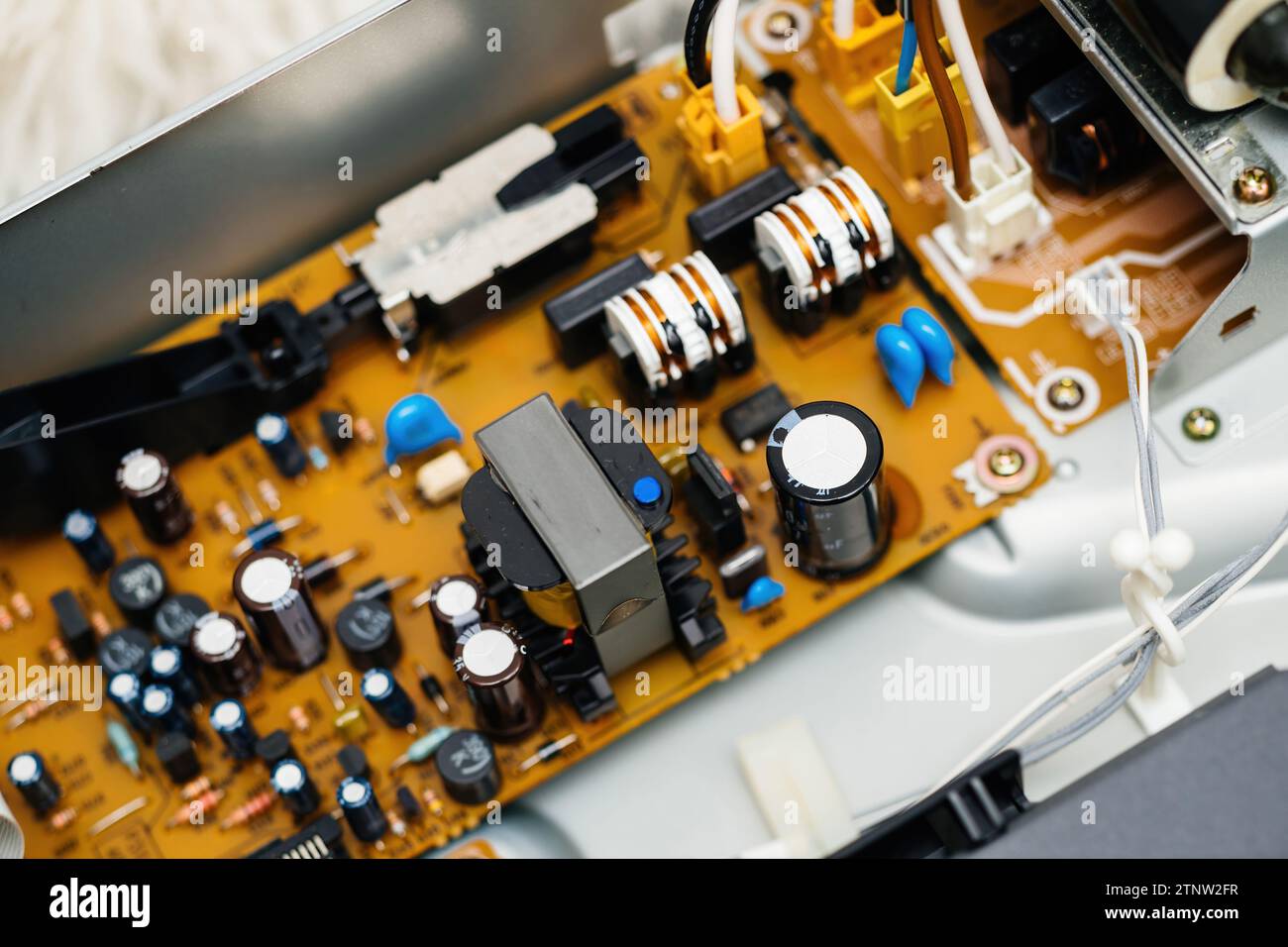 Circuit board of musical video equipment with a yellow plate, blue ...