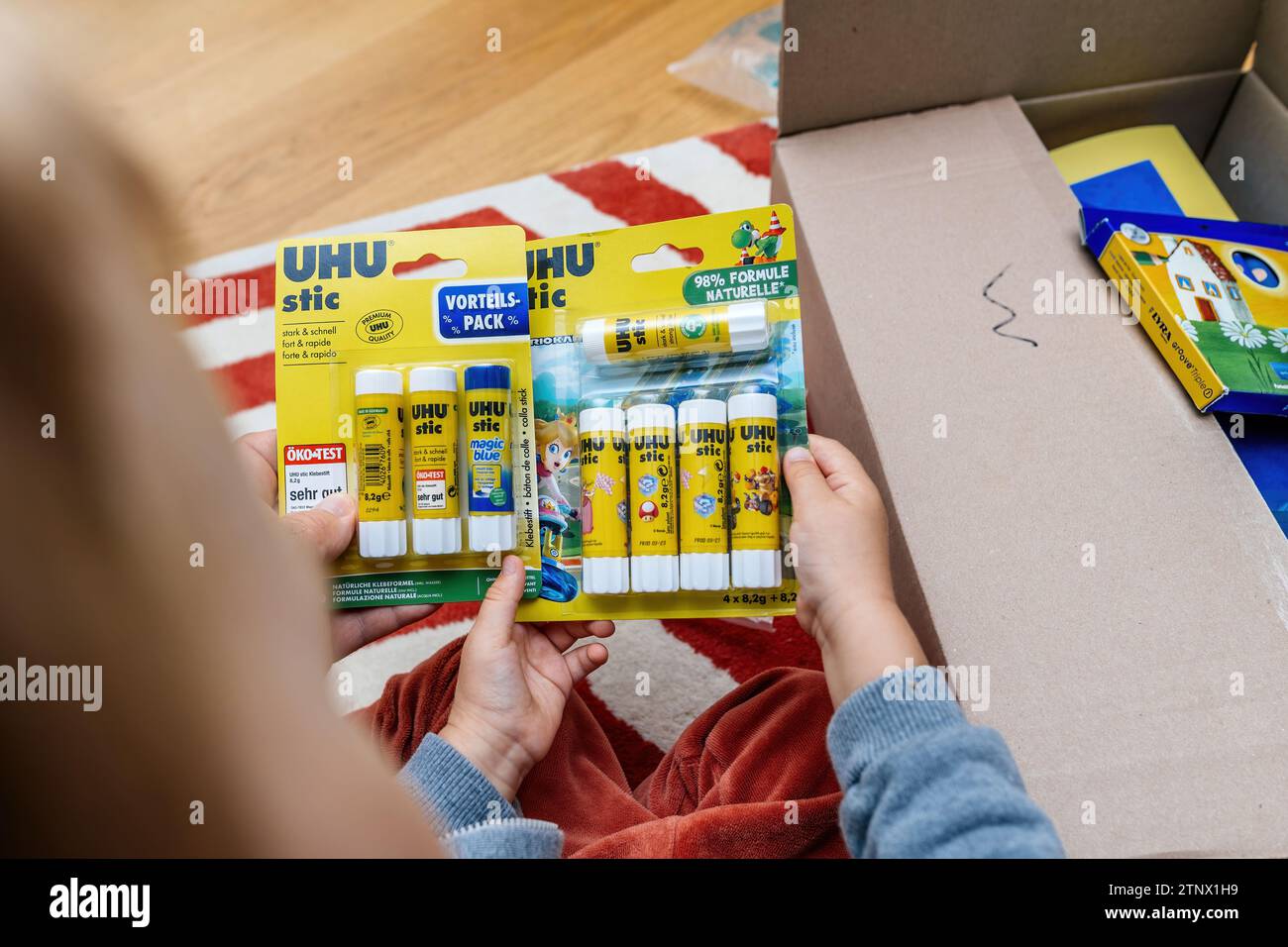 Munich, Germany - Sep 1, 2023: POV of a male hand showing a toddler the ...