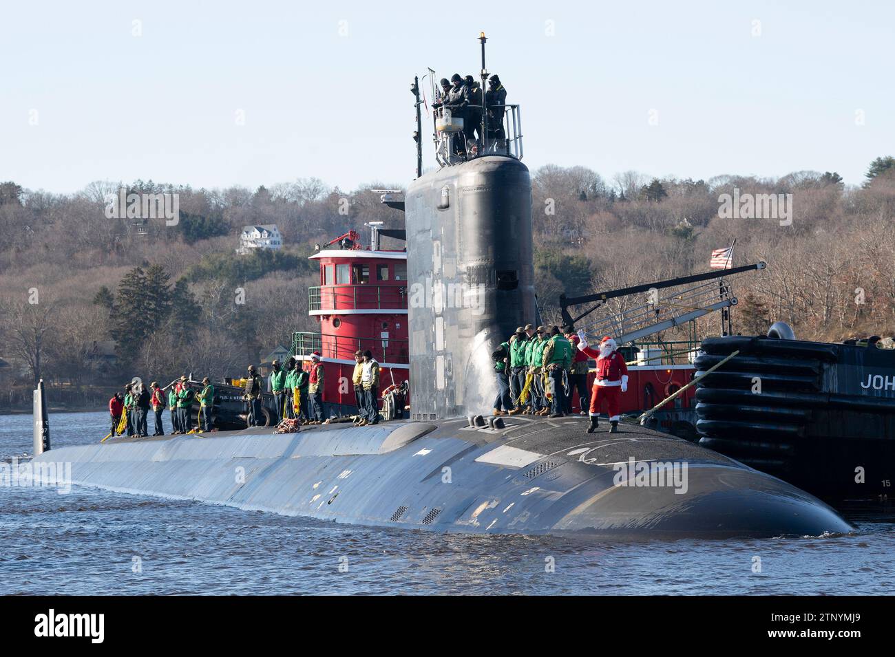 231220-N-UM744-1001 Groton, Conn. (December 20, 2023) Santa waves on ...
