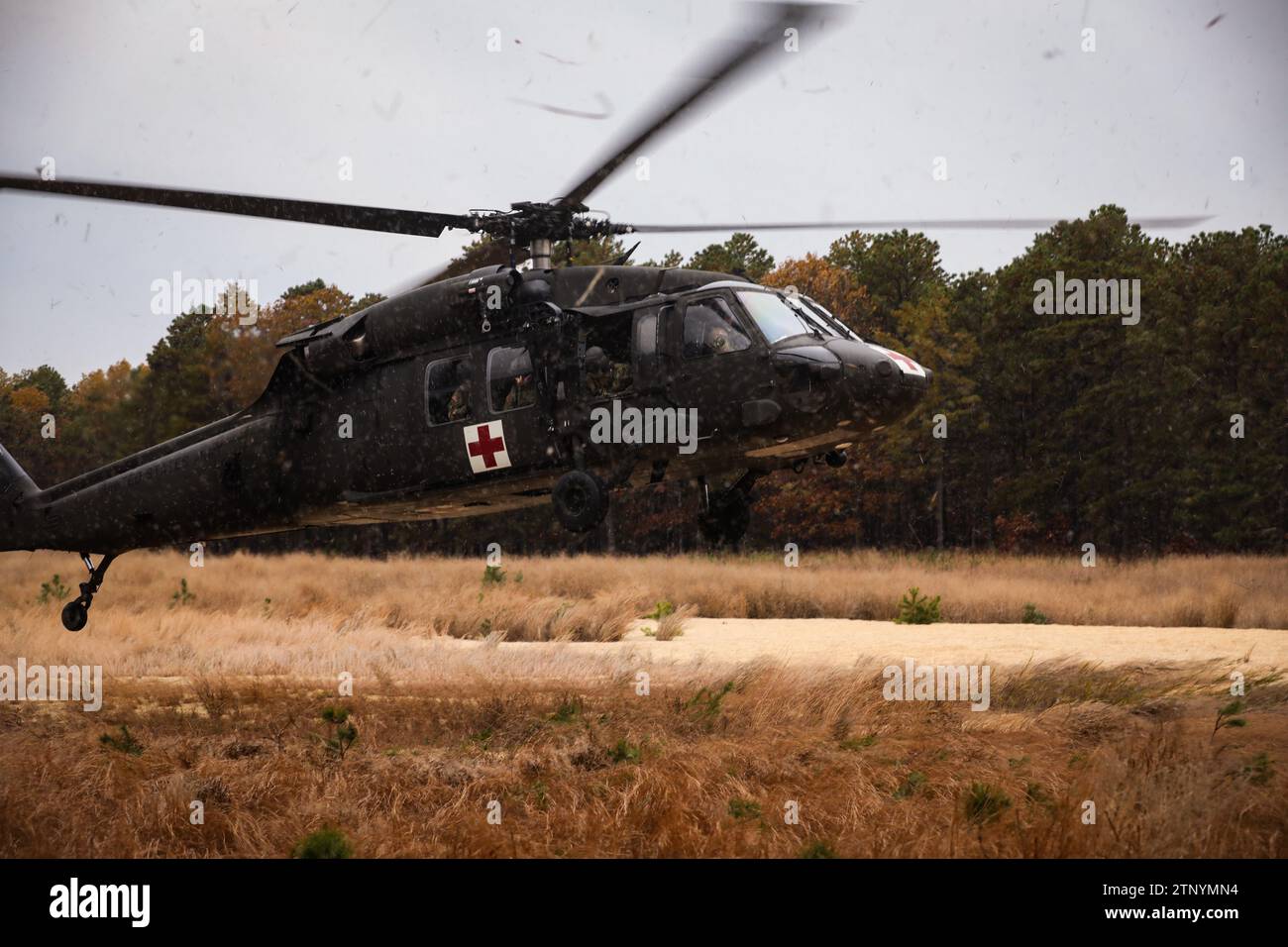 U.S. Army UH-60L Black Hawk helicopter crew chiefs with Charlie Company ...
