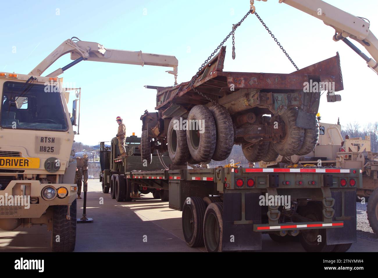 Dual cranes are used to recover a completely disabled vehicle. Regional training Site ...