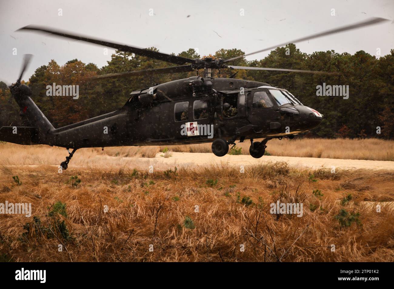 U.S. Army UH-60L Black Hawk helicopter crew chiefs with Charlie Company ...