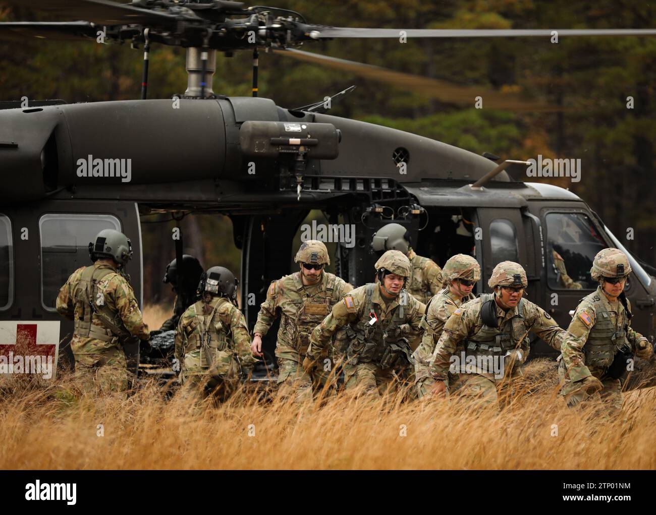 U.S. Army UH-60L Black Hawk helicopter crew chiefs with Charlie Company ...