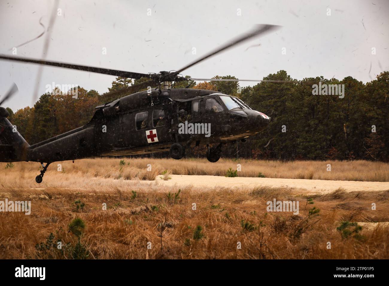 U.S. Army UH-60L Black Hawk helicopter crew chiefs with Charlie Company ...