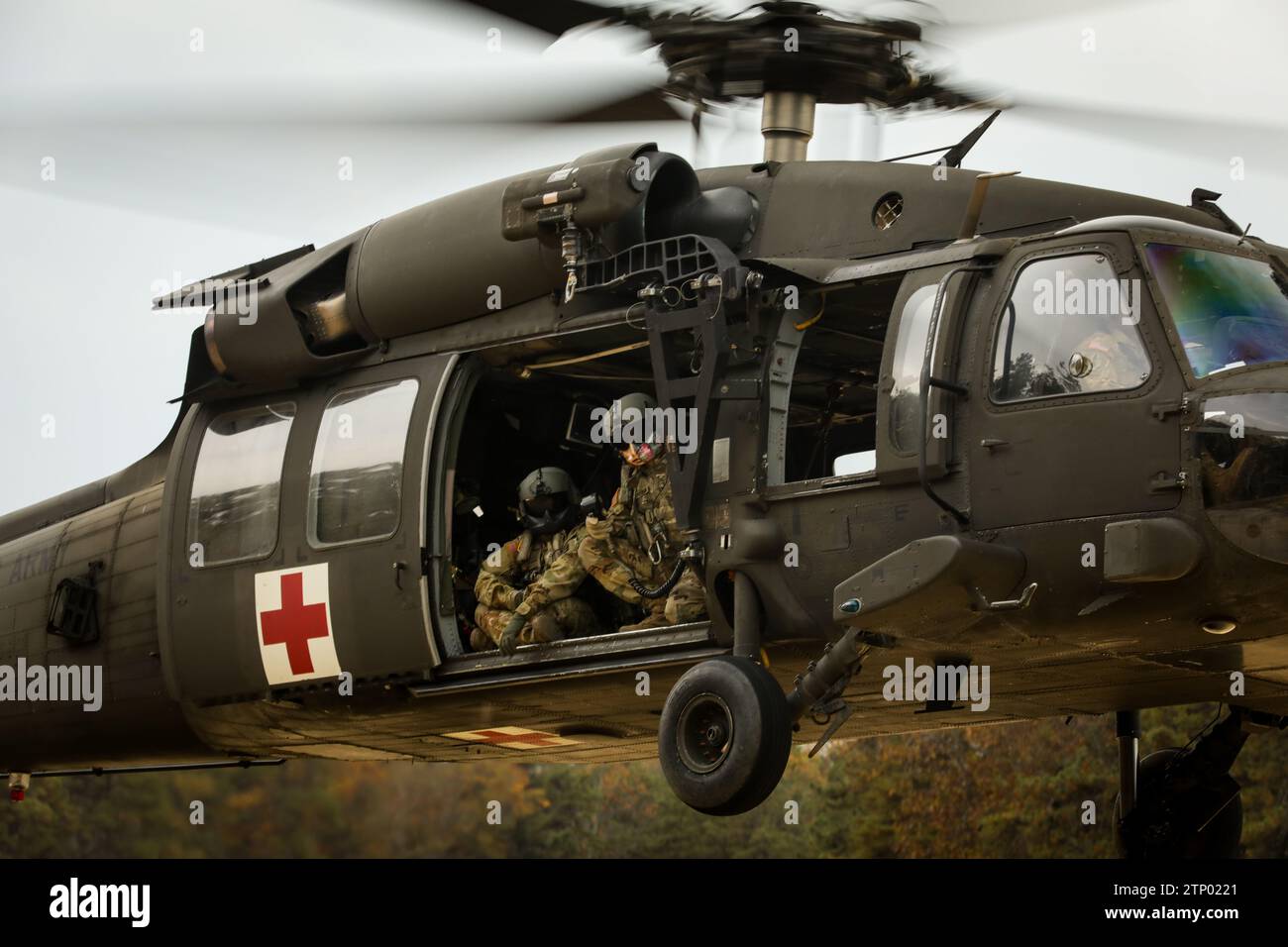 U.S. Army UH-60L Black Hawk helicopter crew chiefs with Charlie Company ...